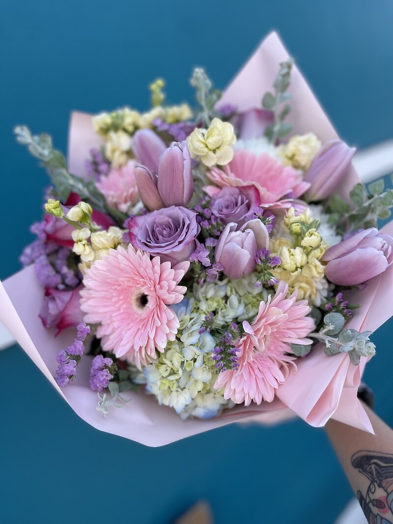Designer's Choice Soft Pastels Wrapped Bouquet arranged by a florist in ...
